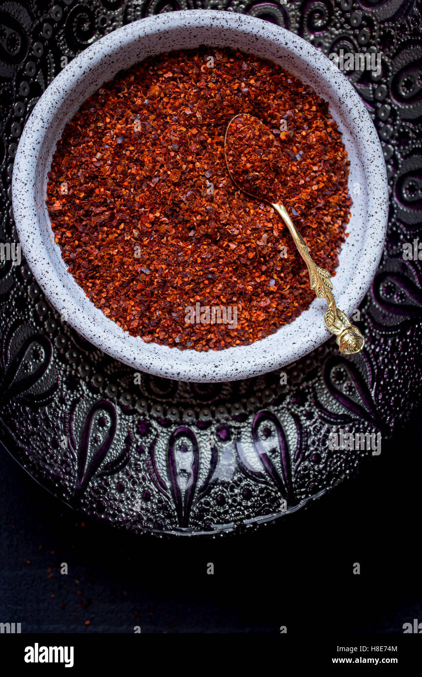 Chilli spices in a bowl Stock Photo - Alamy