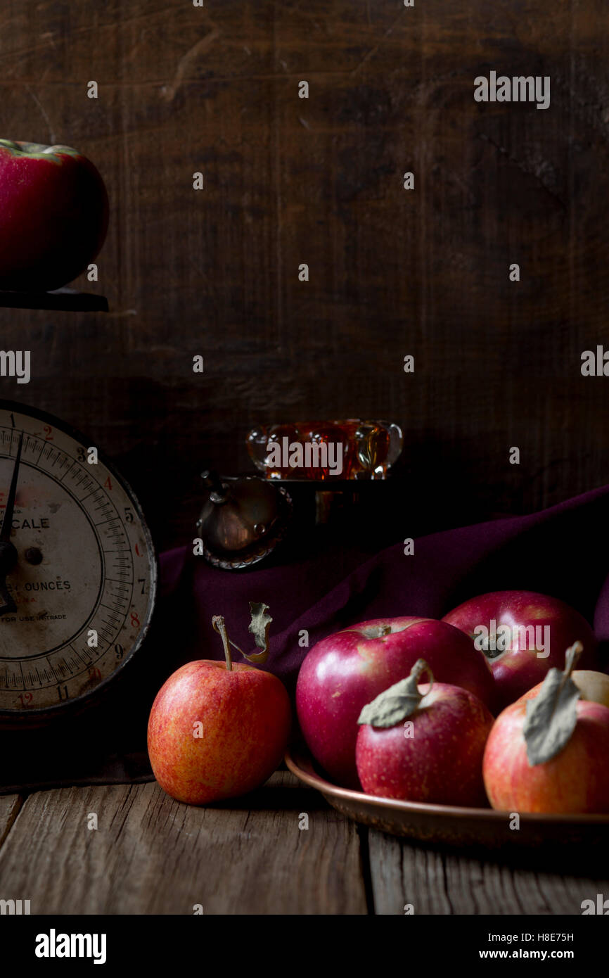 Red Apples in a vintage setting with scales Stock Photo - Alamy