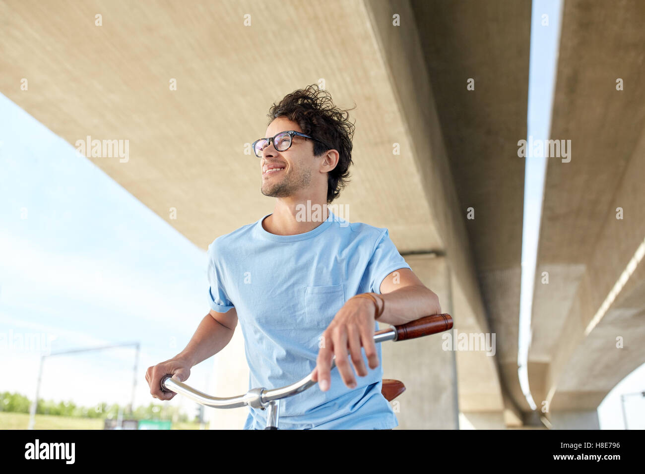 young hipster man riding fixed gear bike Stock Photo - Alamy