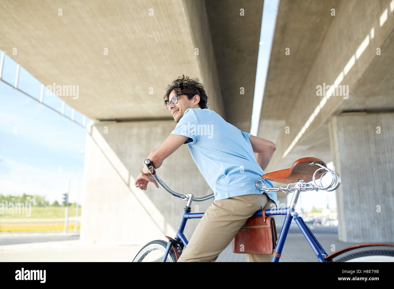 young hipster man riding fixed gear bike Stock Photo - Alamy