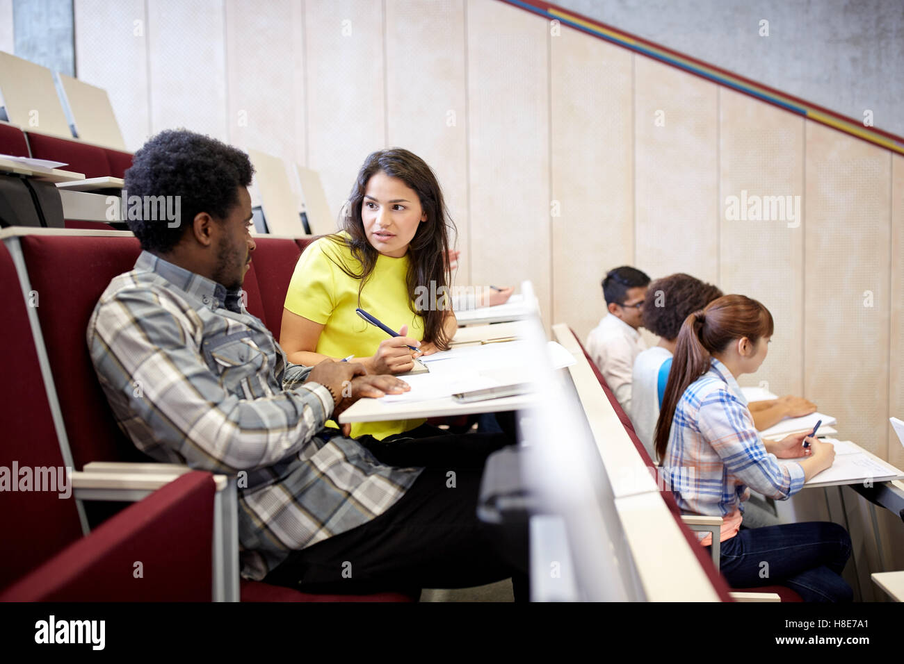group of students with notebooks at lecture hall Stock Photo - Alamy