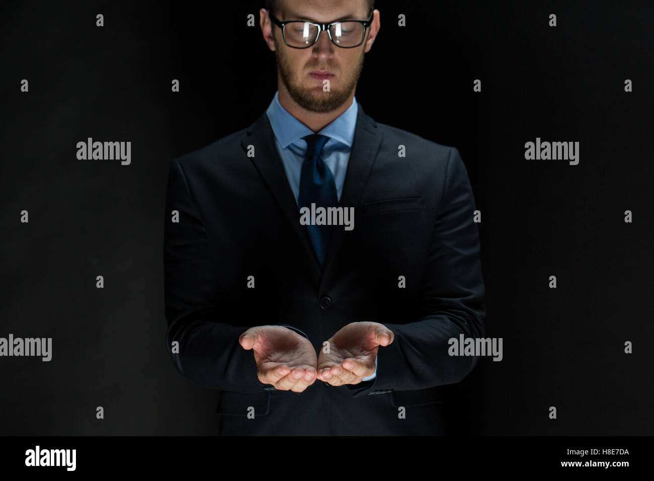 close up of businessman holding something in hands Stock Photo - Alamy