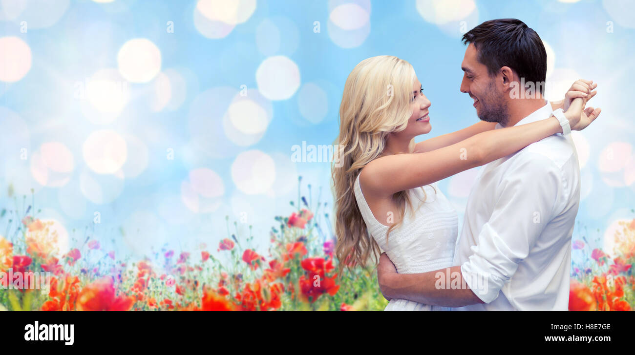 happy couple hugging over natural background Stock Photo - Alamy
