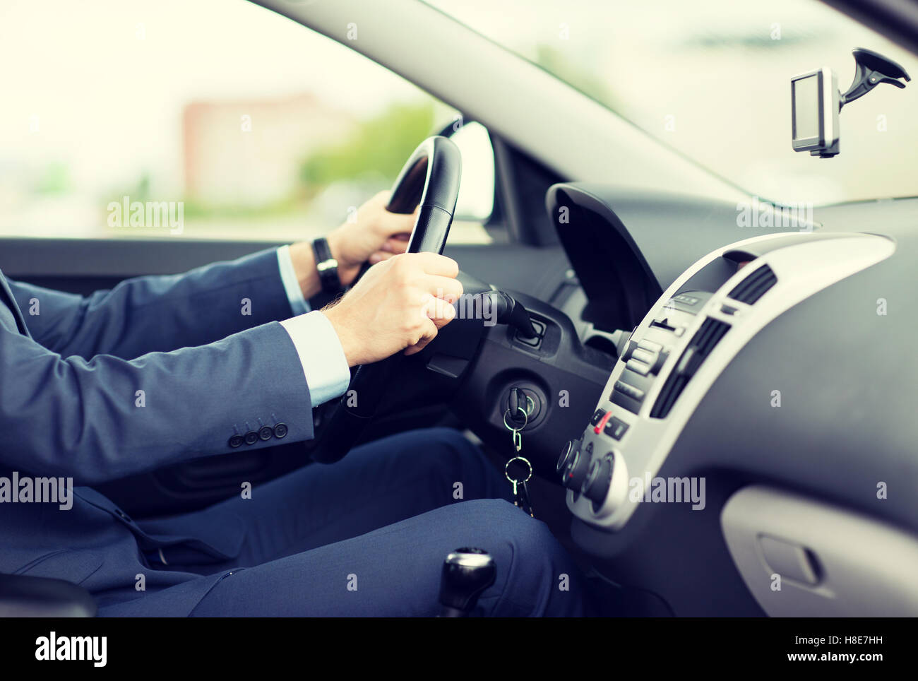close up of young man in suit driving car Stock Photo - Alamy