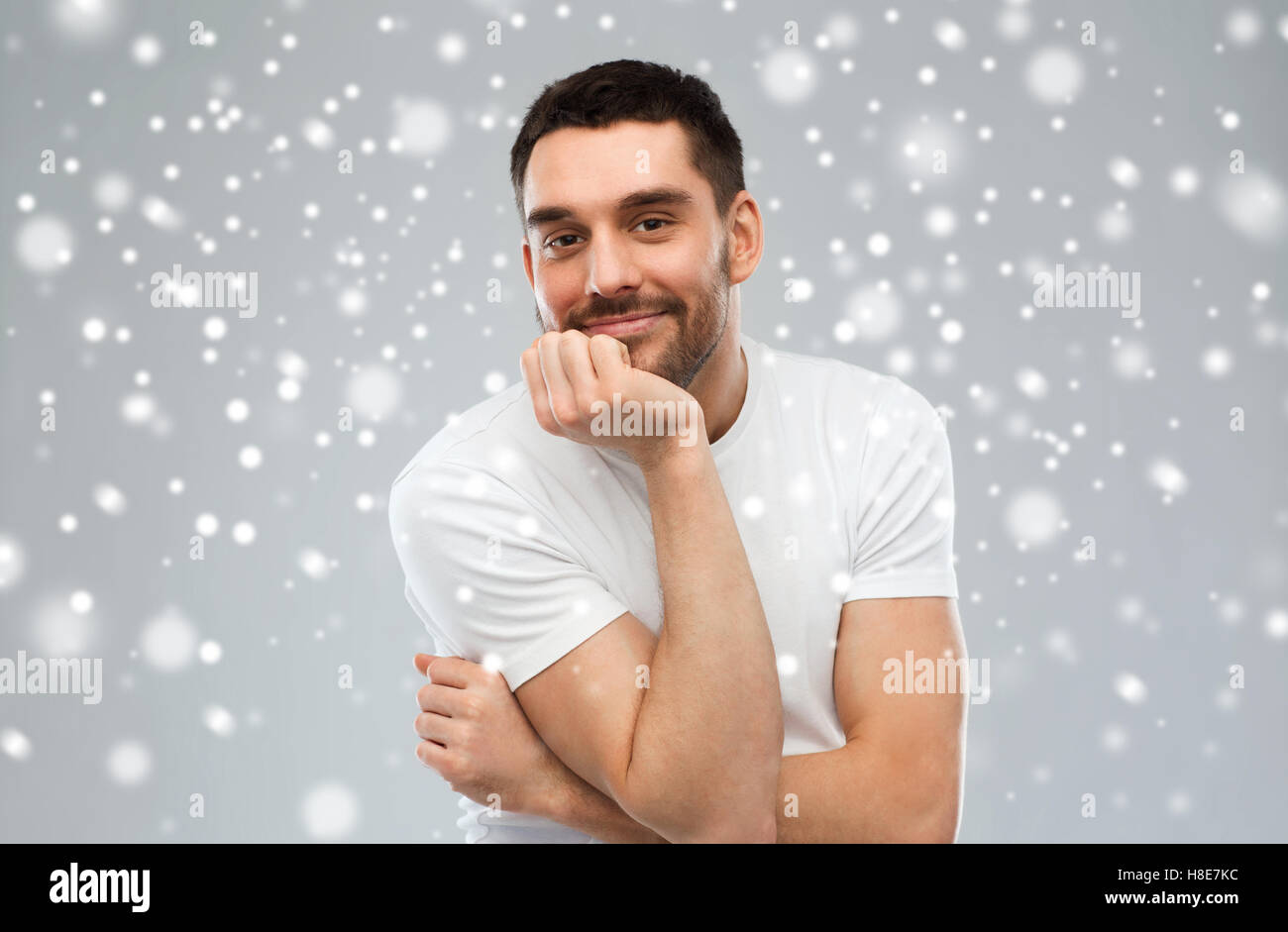 smiling man over snow background Stock Photo - Alamy