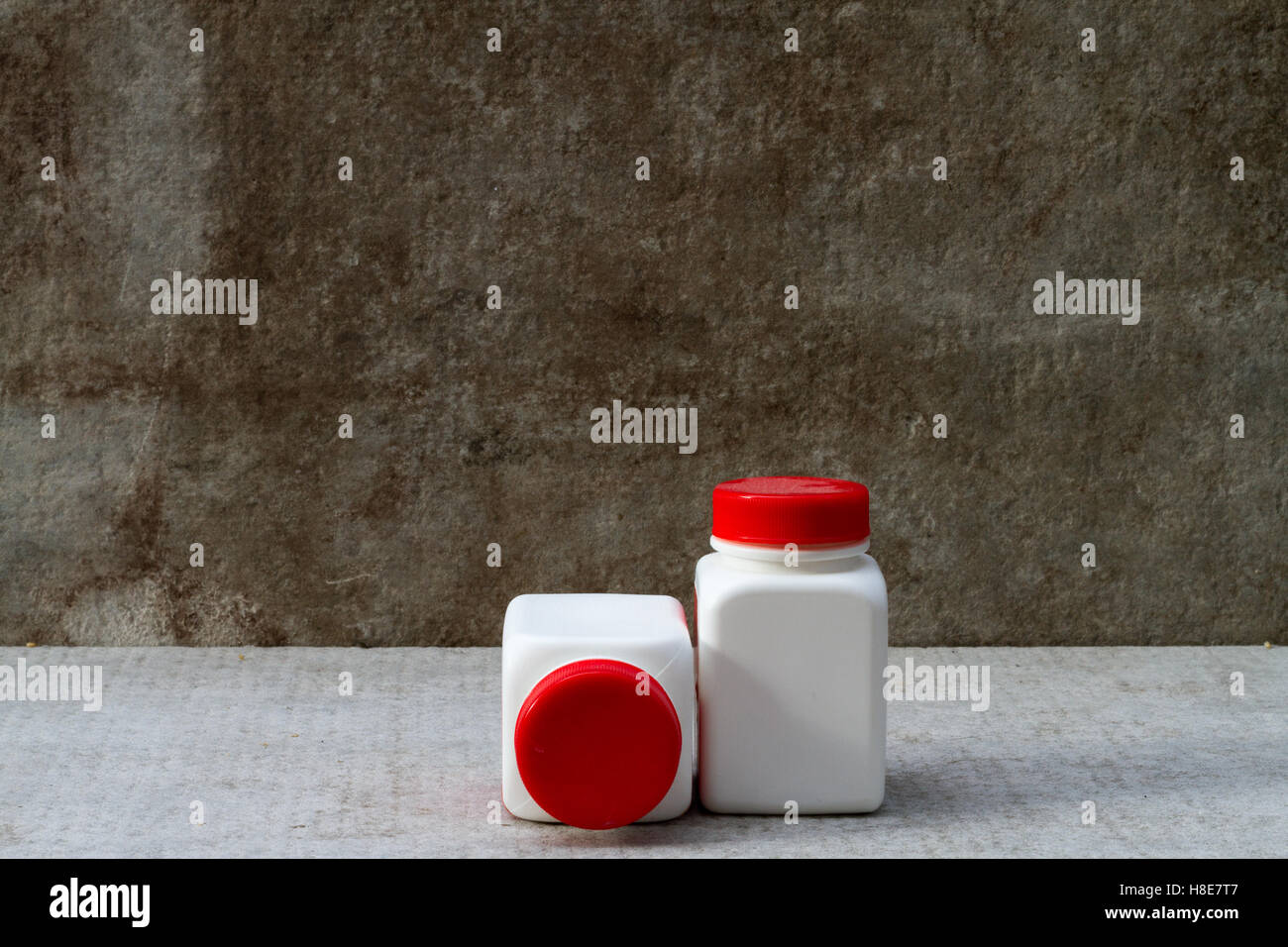 White plastic bottle on floor Stock Photo - Alamy