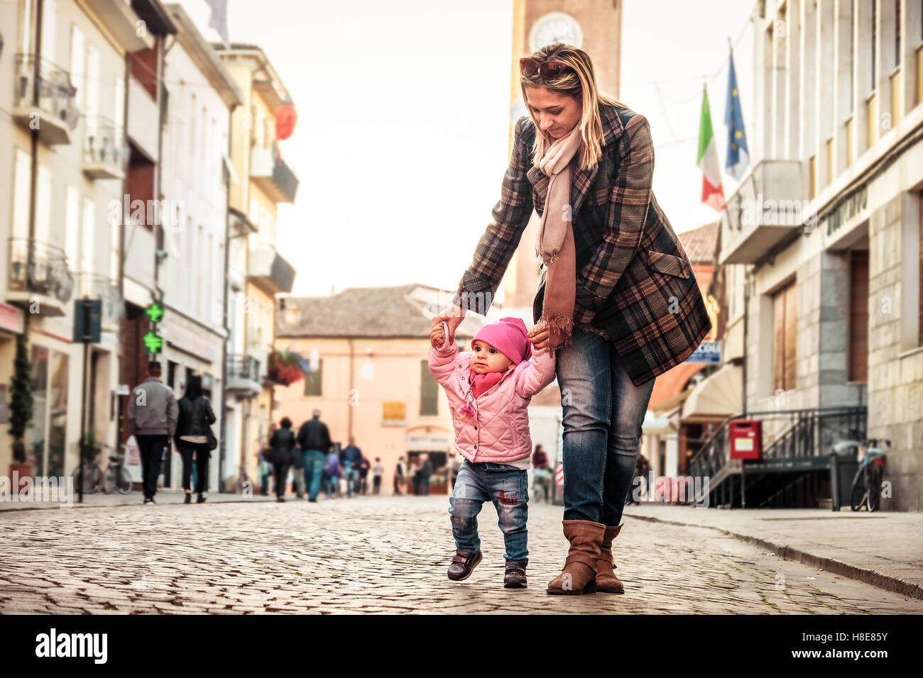 mother help baby walk Stock Photo - Alamy