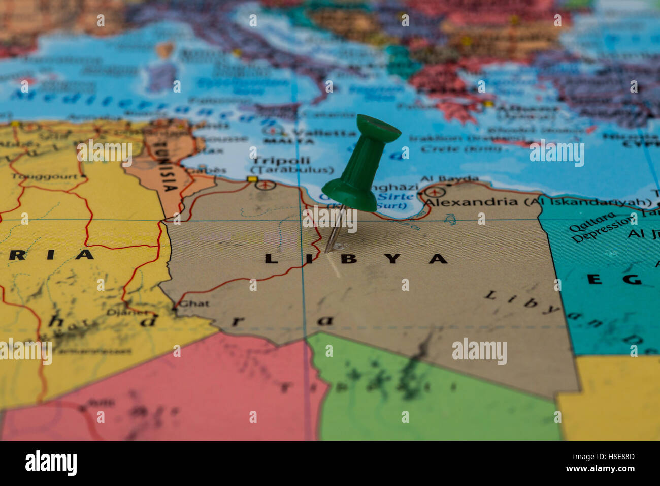 Map of Libya with a green pushpin stuck Stock Photo - Alamy