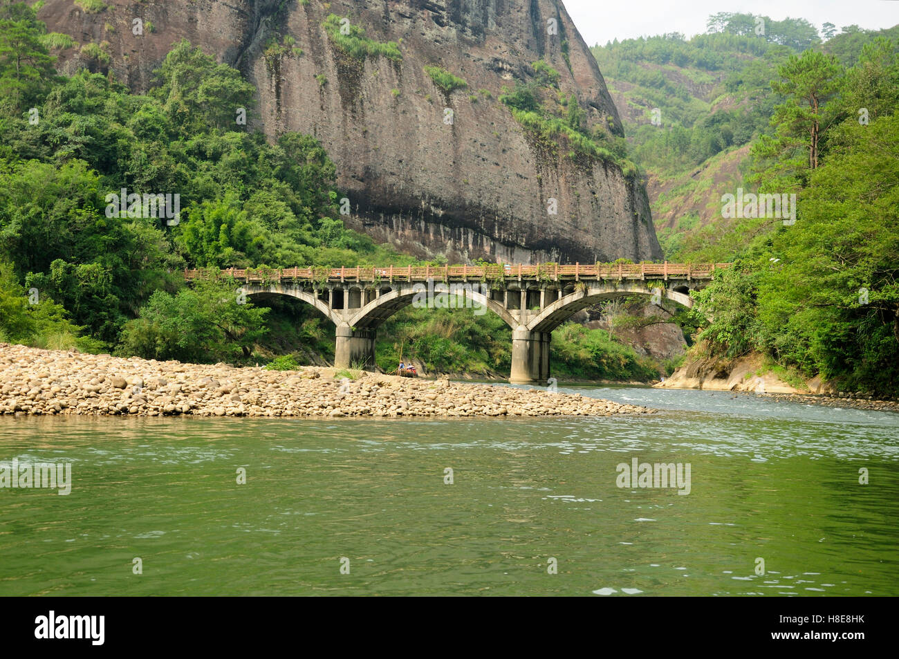 A stone bridge over the nine bend river, Jiuxi, in Wuyishan or mount ...