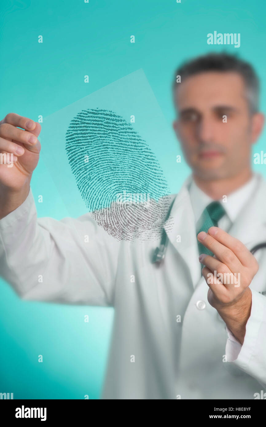 doctor holding finger print film scan Stock Photo - Alamy