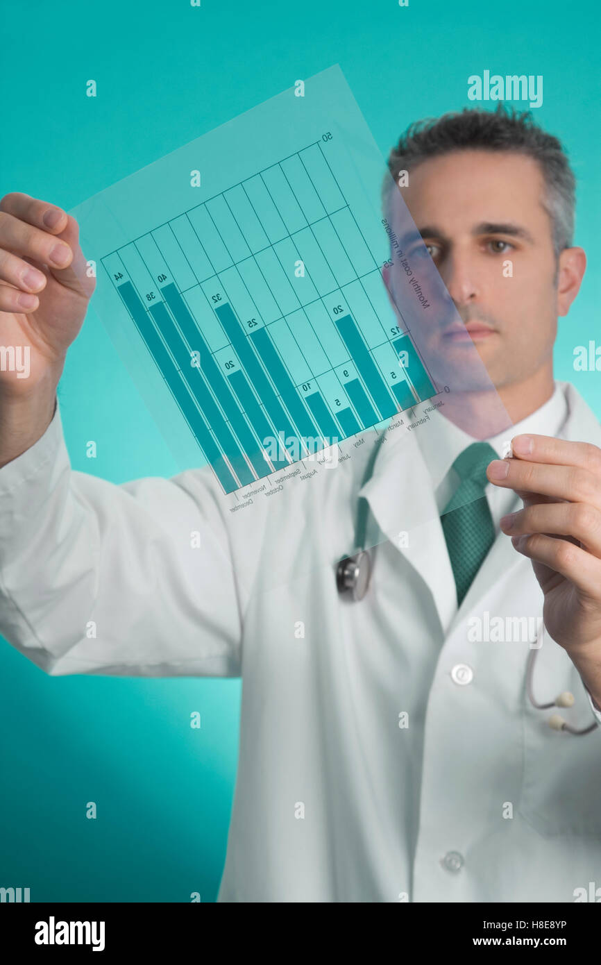 doctor holding bar graph chart Stock Photo - Alamy