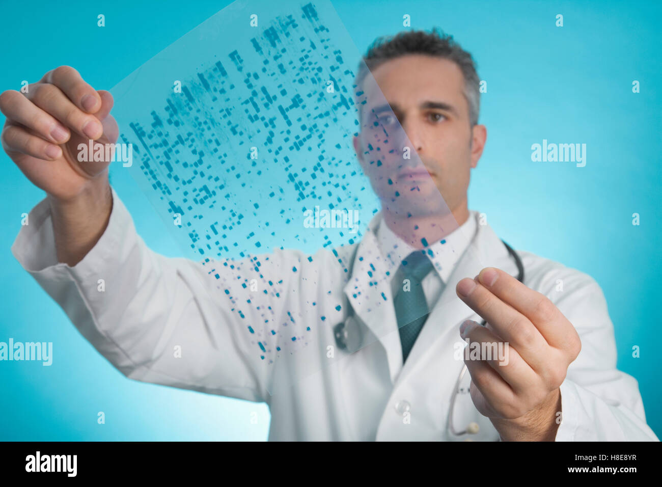 doctor holding DNA film scan Stock Photo - Alamy
