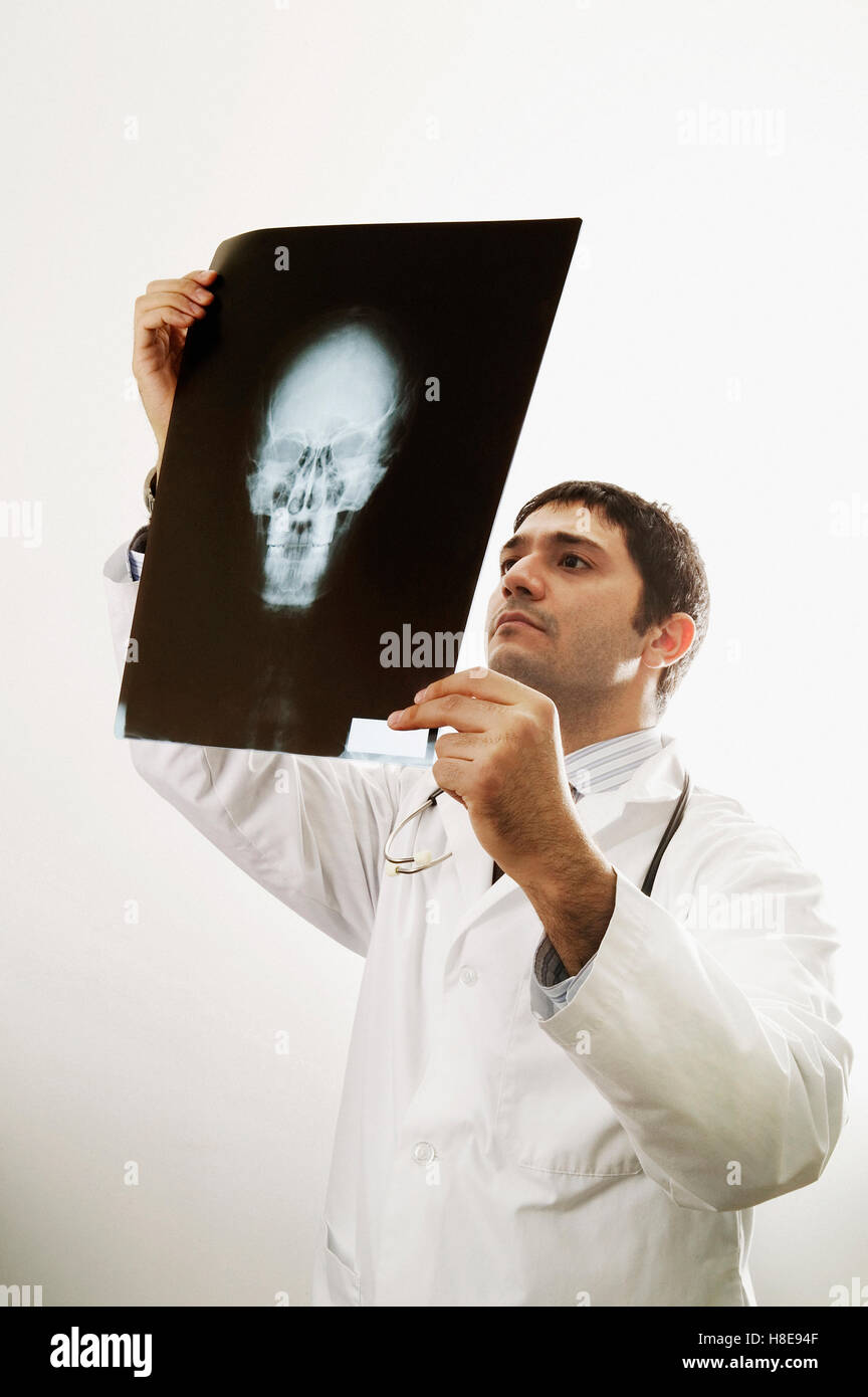 Doctor holding X-ray Stock Photo - Alamy