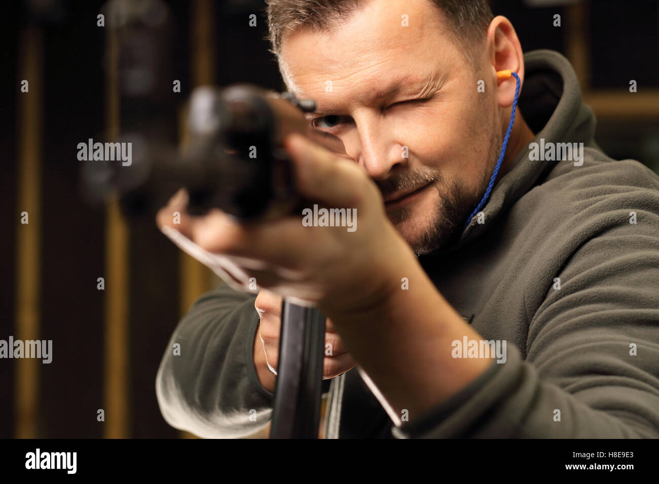 The man at the shooting range. Science use of firearms Stock Photo - Alamy