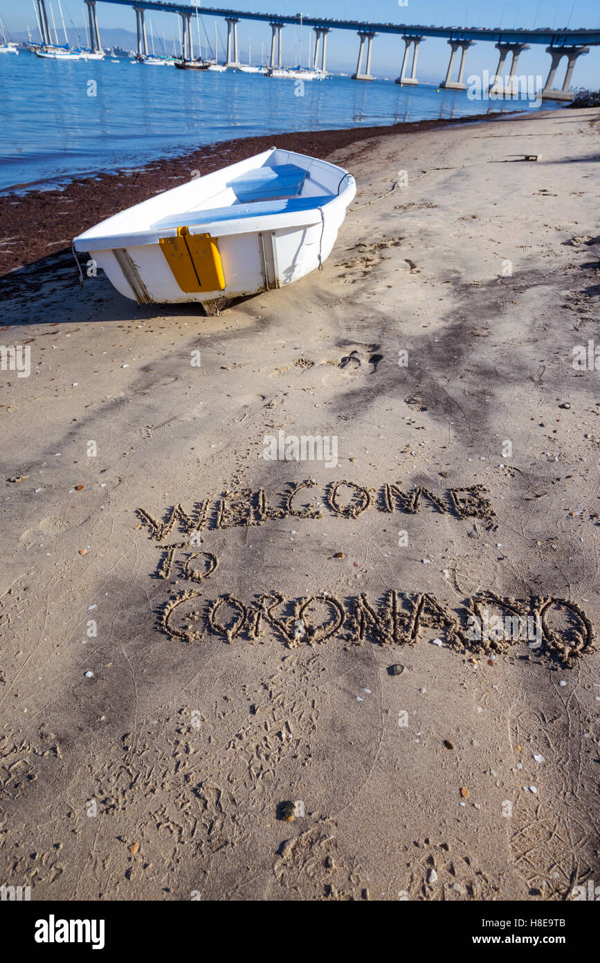 "welcome to Coronado" written on the sand. Coronado Bridge in ...