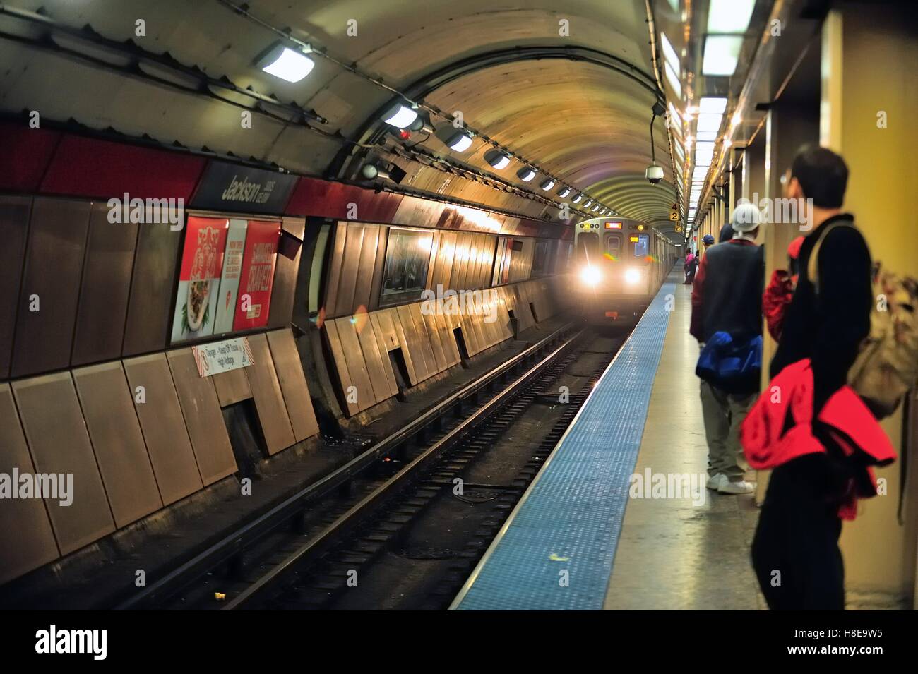 Passengers await a subway train at the Jackson Boulevard subway stop ...
