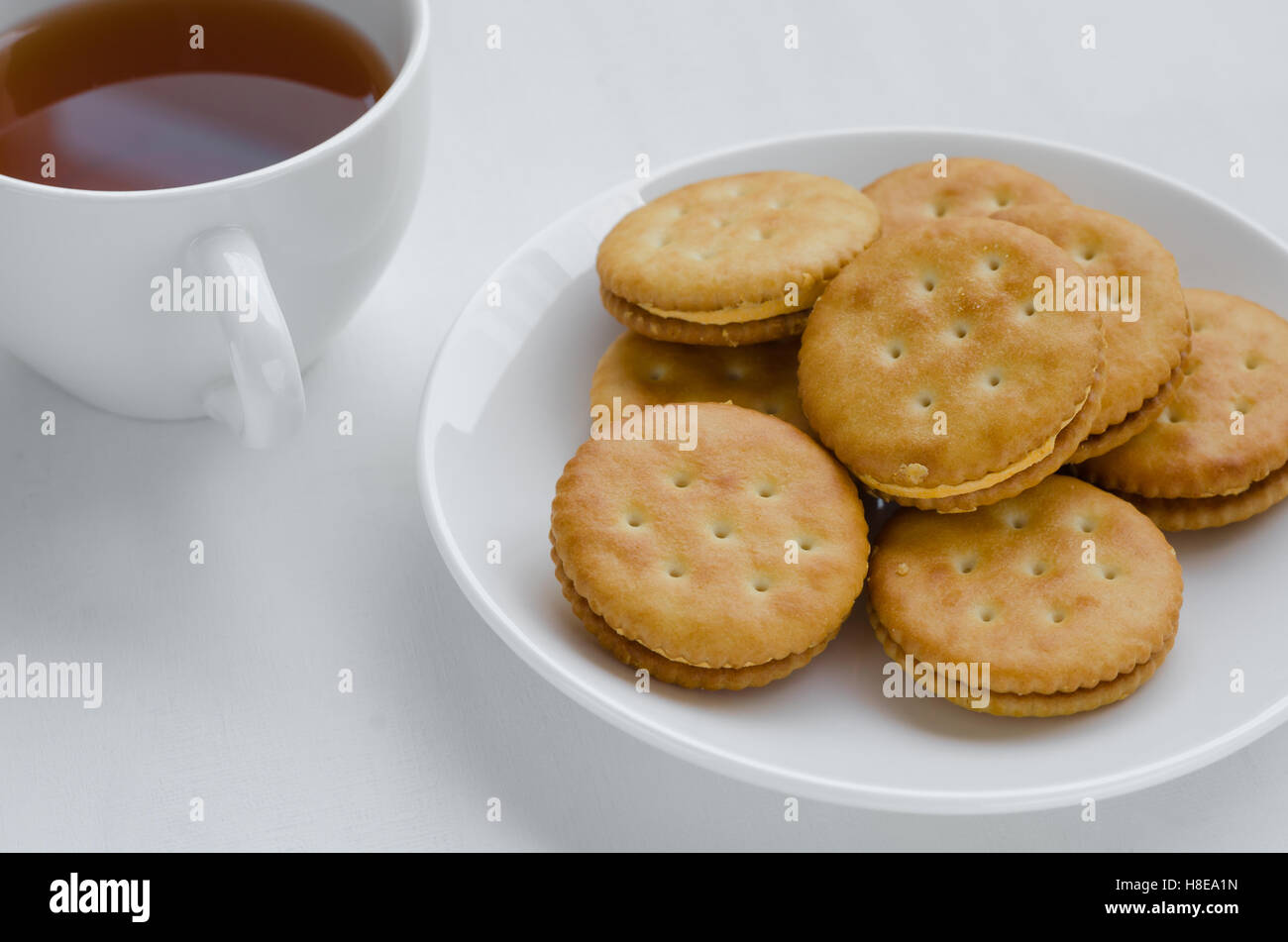Sandwich Cream Crackers with Hot Tea for Breaking Time Stock Photo - Alamy