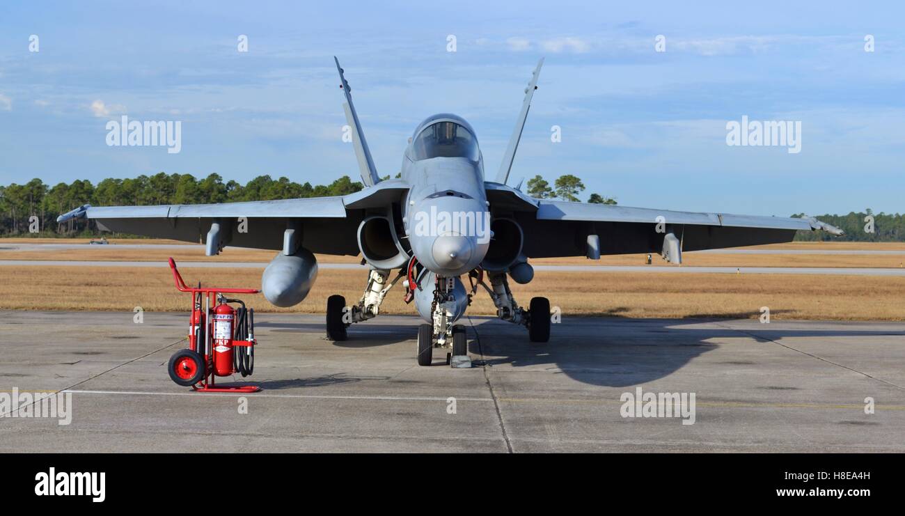 U.S. Navy F/A-18 Hornet fighter jet prepares for take-off on the runway ...