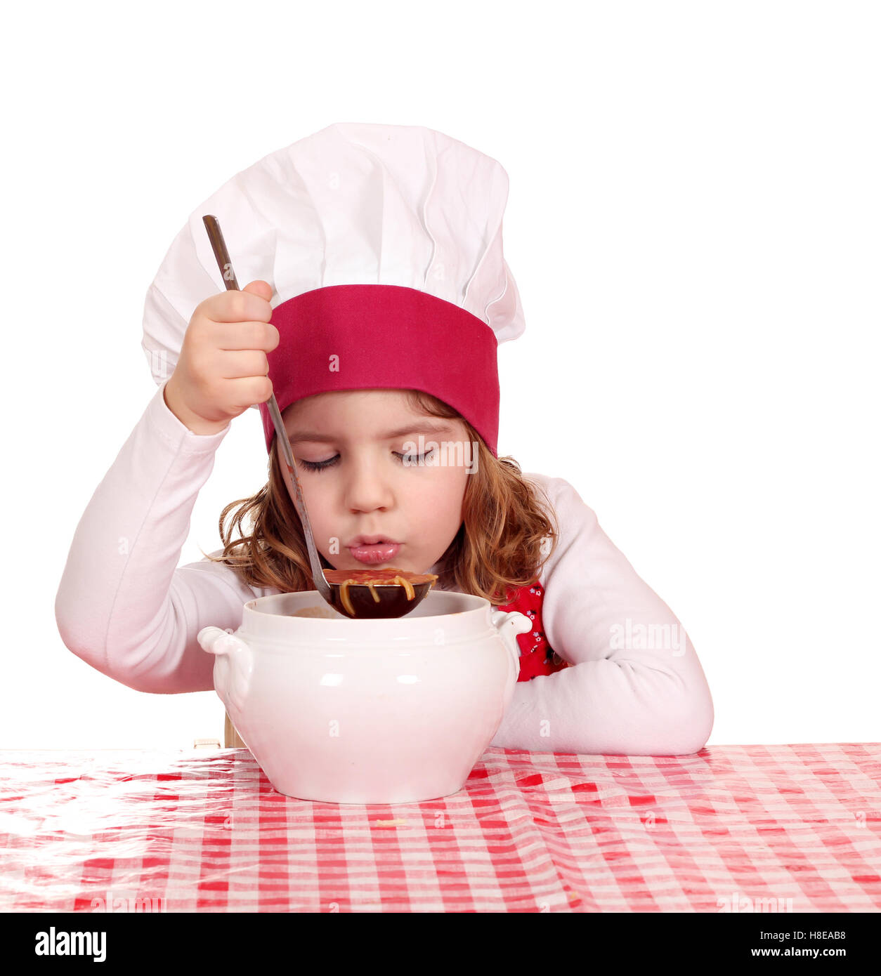 little girl cook taste soup Stock Photo - Alamy