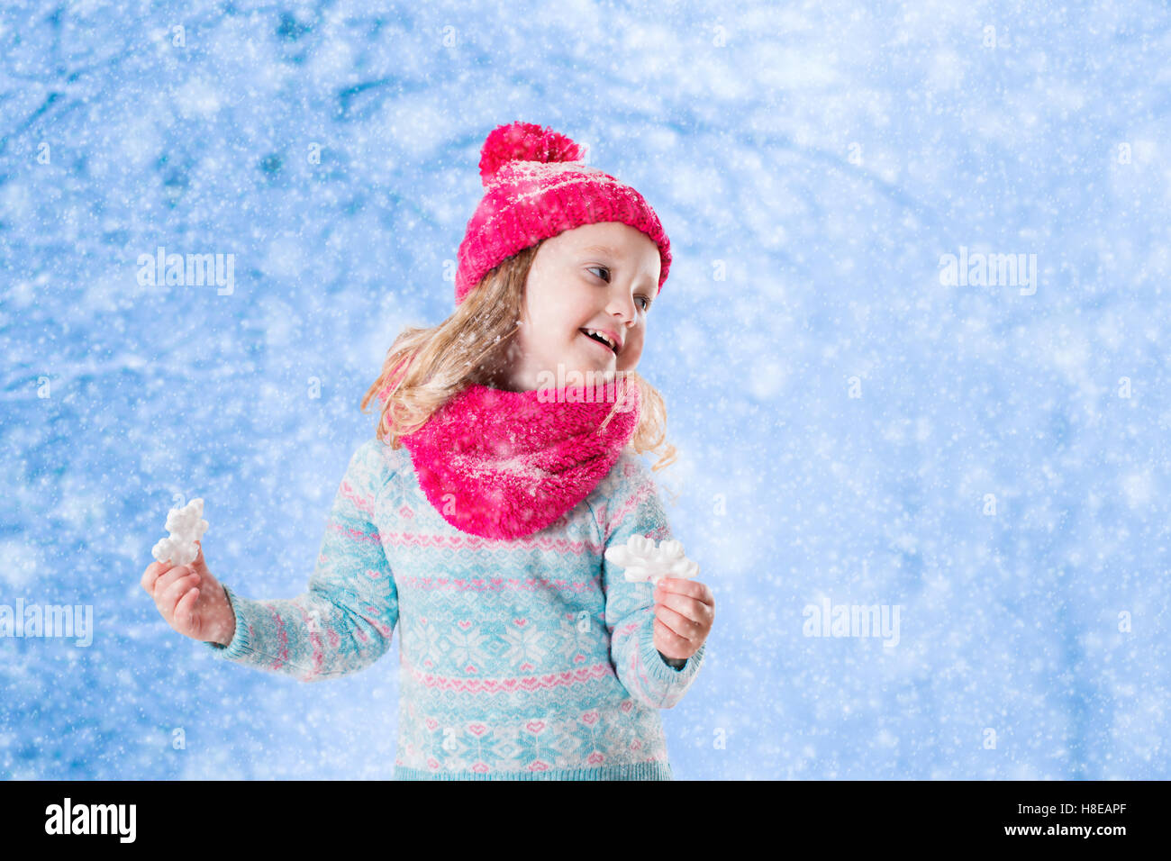 Girl catching snow in hands hi-res stock photography and images - Alamy