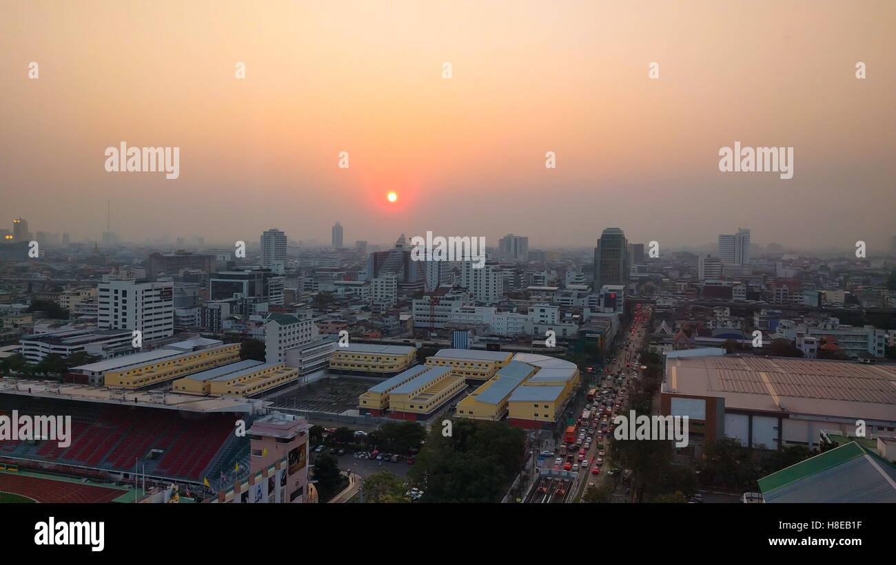 Sunset over polluted city air Stock Photo - Alamy