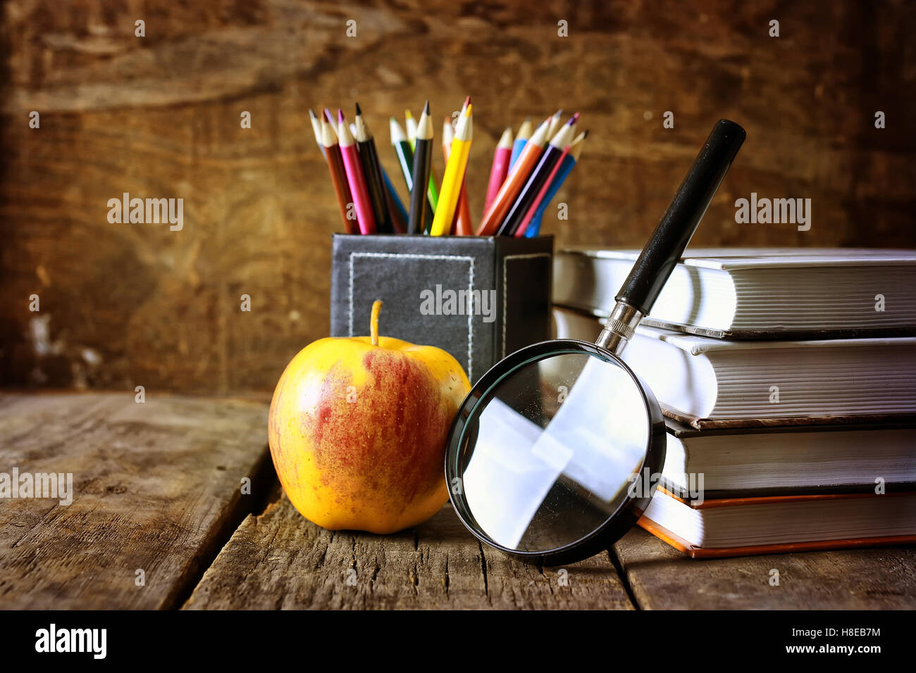 magnifying glass education book Stock Photo - Alamy