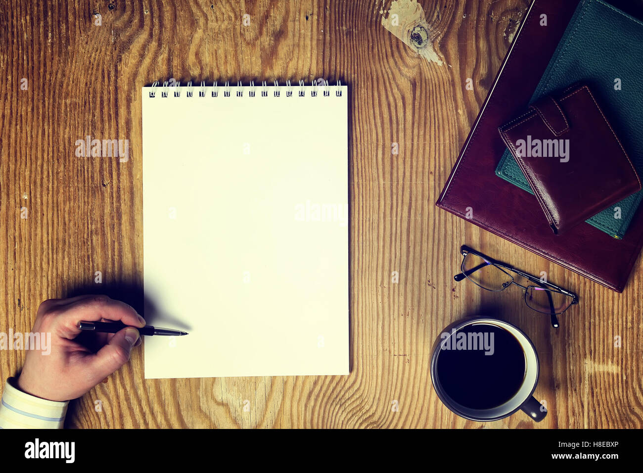 toned table write hand top view Stock Photo - Alamy