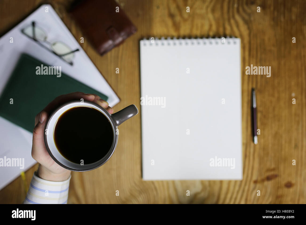table write hand office view Stock Photo - Alamy