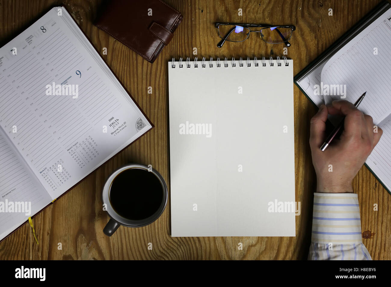 table write hand office view Stock Photo - Alamy