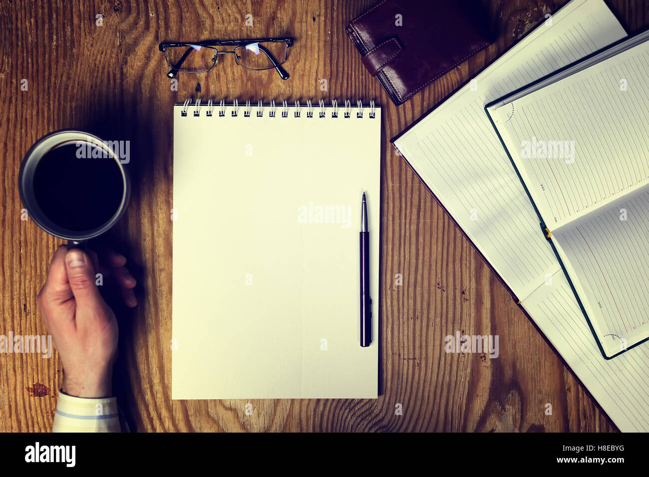 toned table write hand top view Stock Photo - Alamy