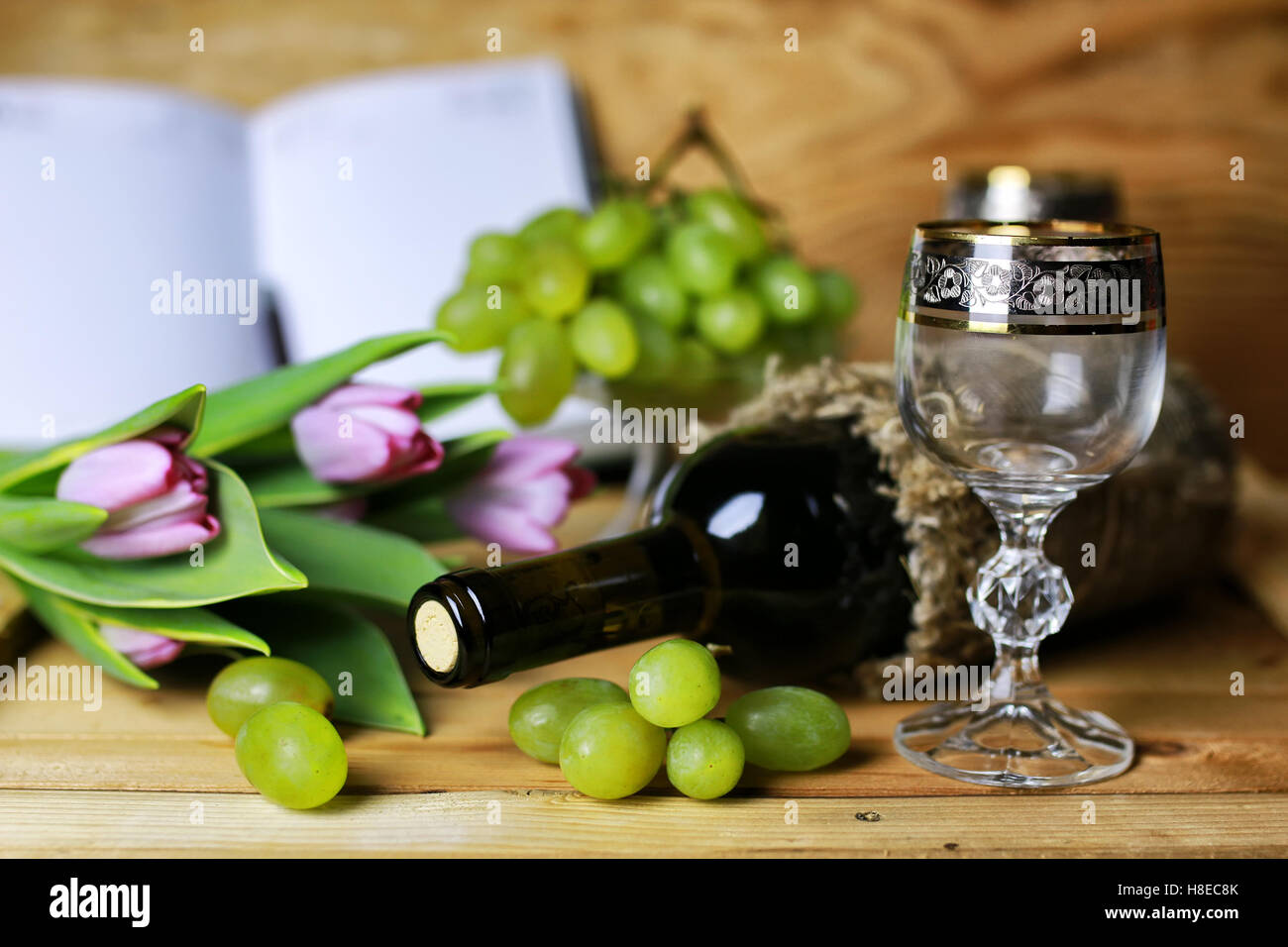 wine bottle book and glass grape Stock Photo - Alamy