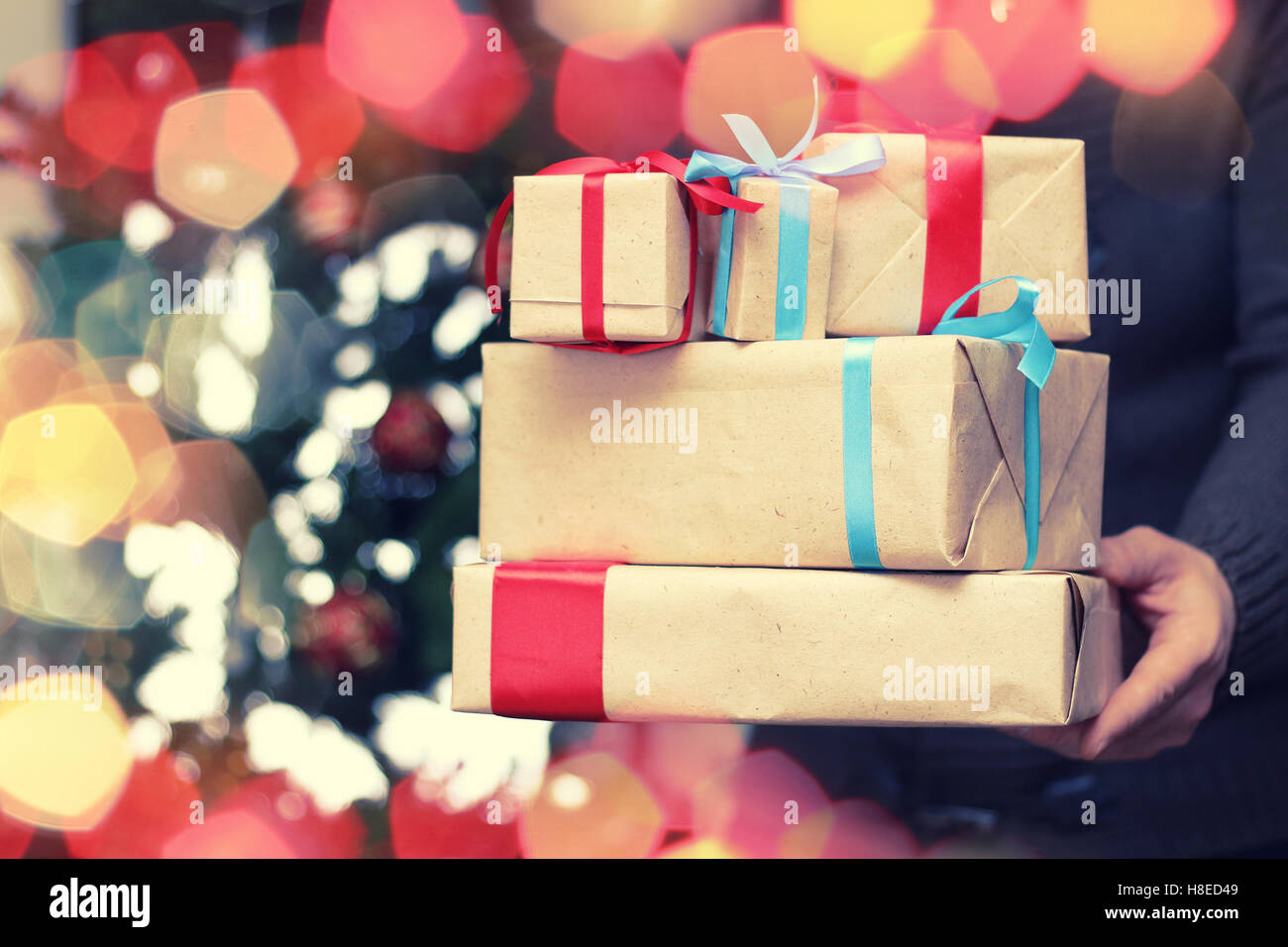 gift stack hand christmas Stock Photo - Alamy