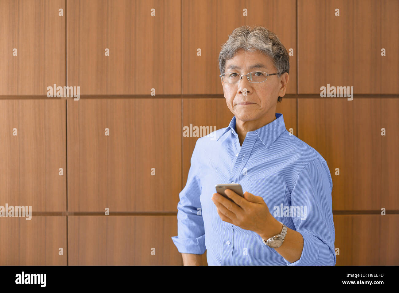 Fashionable Japanese senior man portrait Stock Photo - Alamy