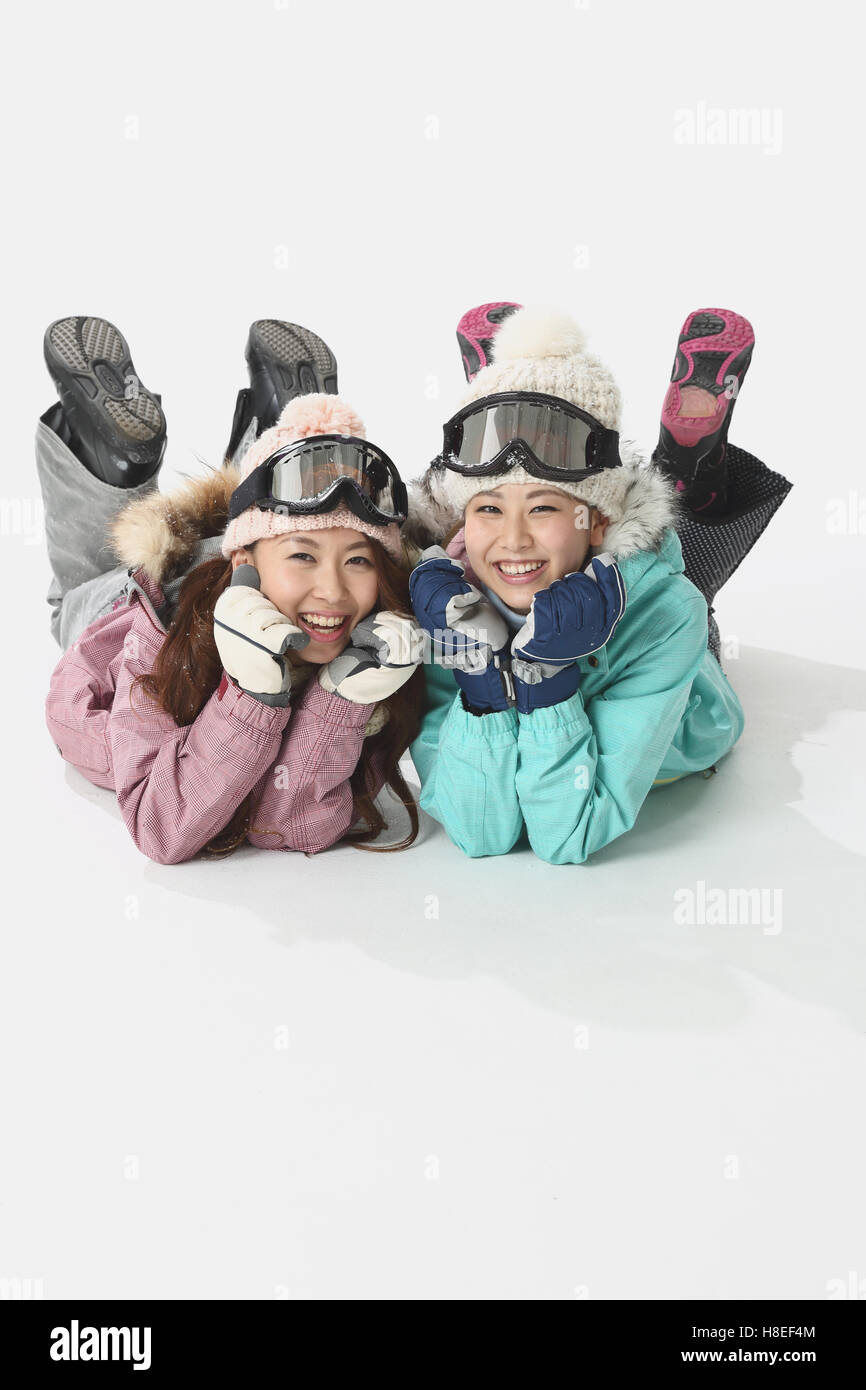 Young Japanese women wearing snowboard wear on white background Stock Photo - Alamy