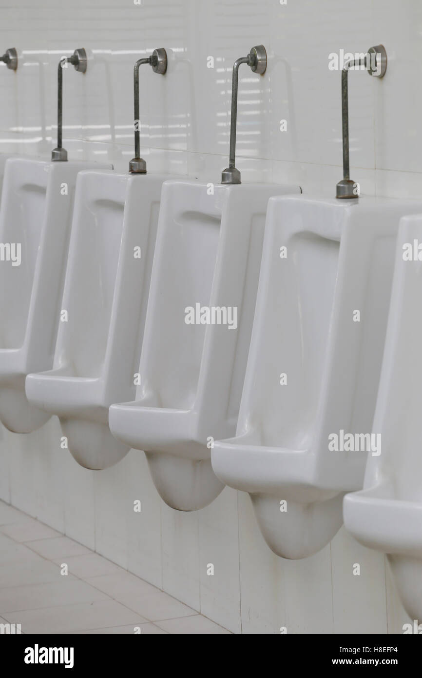 Modern urinal in men bathroom, white ceramic urinals for men in toilet ...