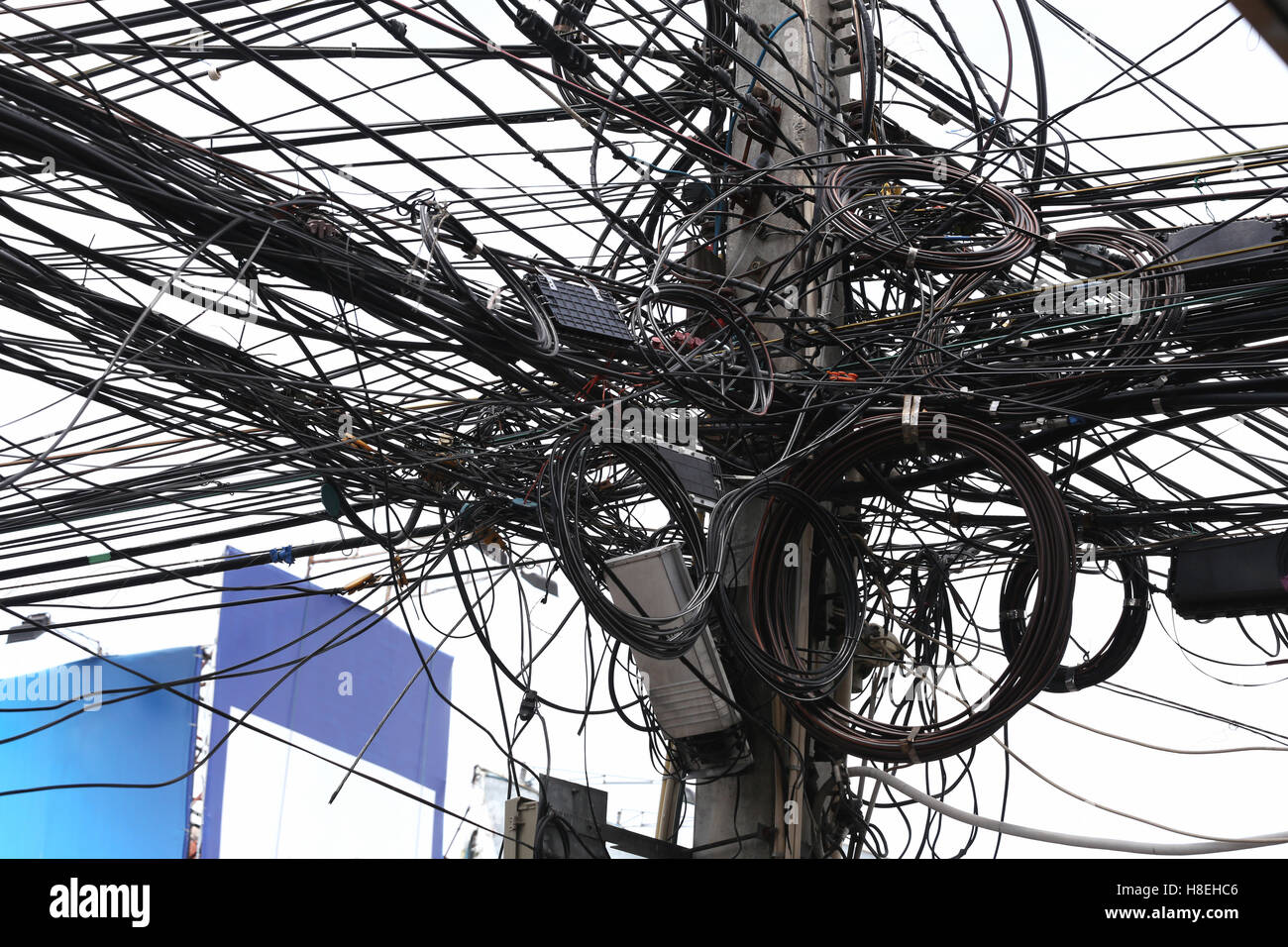 Messy cable electricity post due to poor planning on installing the ...