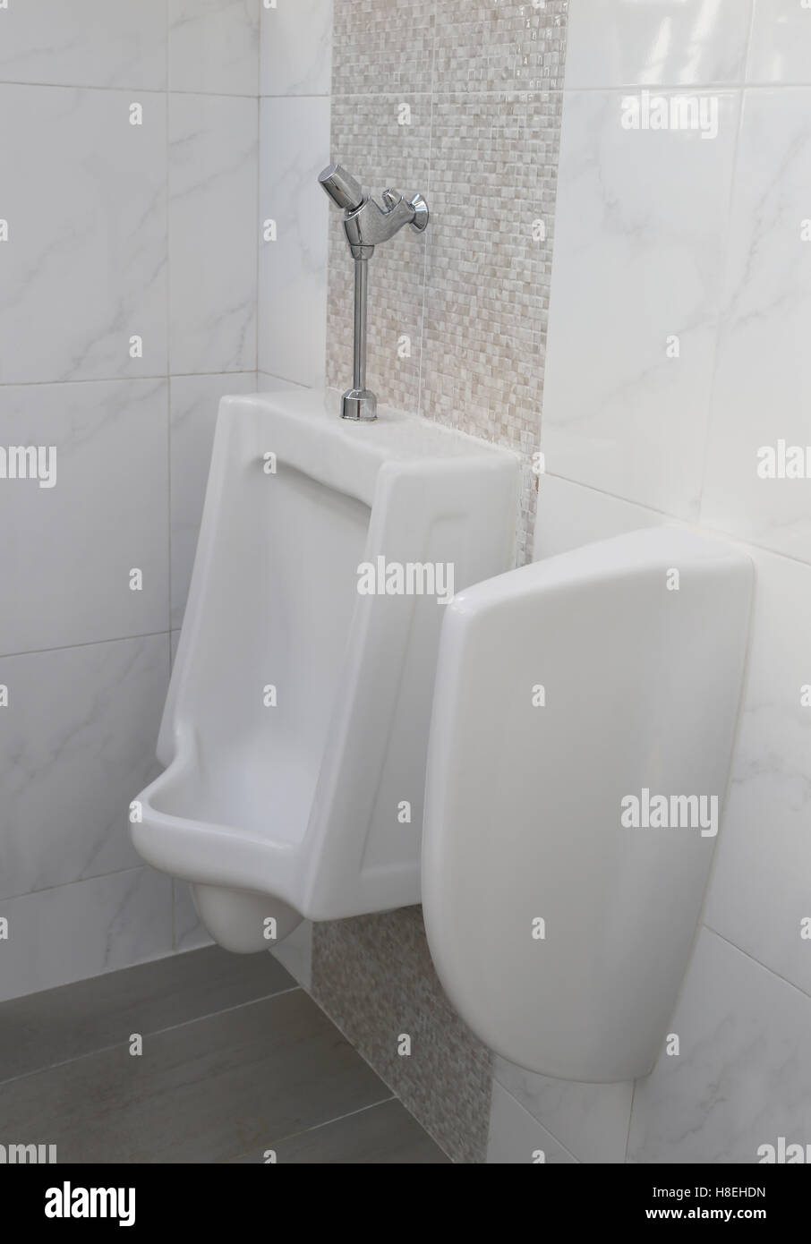 Modern urinal in men bathroom, white ceramic urinals for men in toilet ...