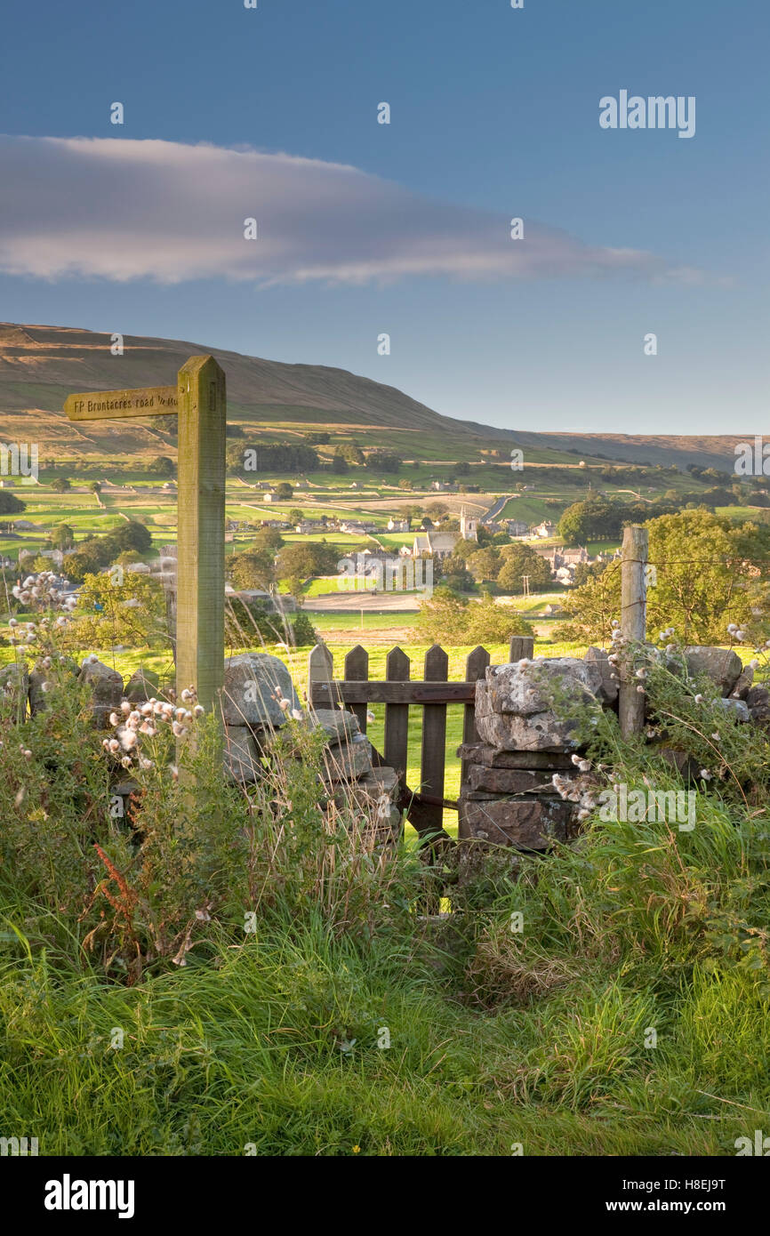 A footpath signpost and gate leading to Hawes village in Wensleydale ...