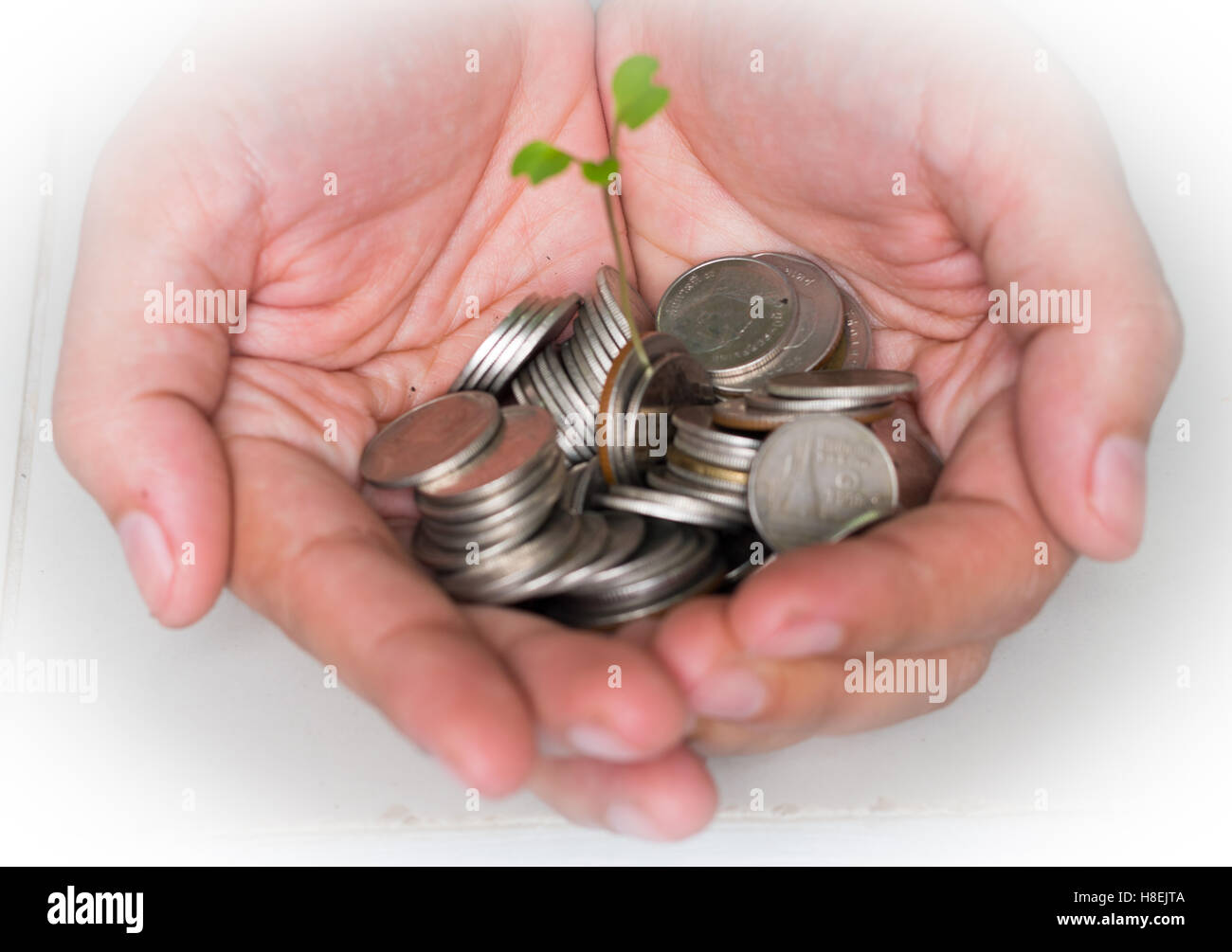 Handful of coins hi-res stock photography and images - Alamy