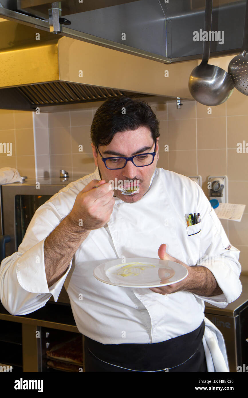 cook working in a kitchen restaurant Stock Photo - Alamy