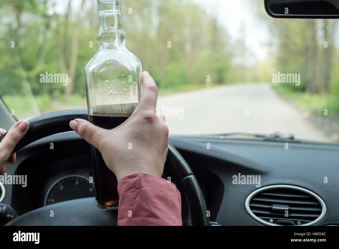 picture of woman drinking alcohol in the car Stock Photo - Alamy