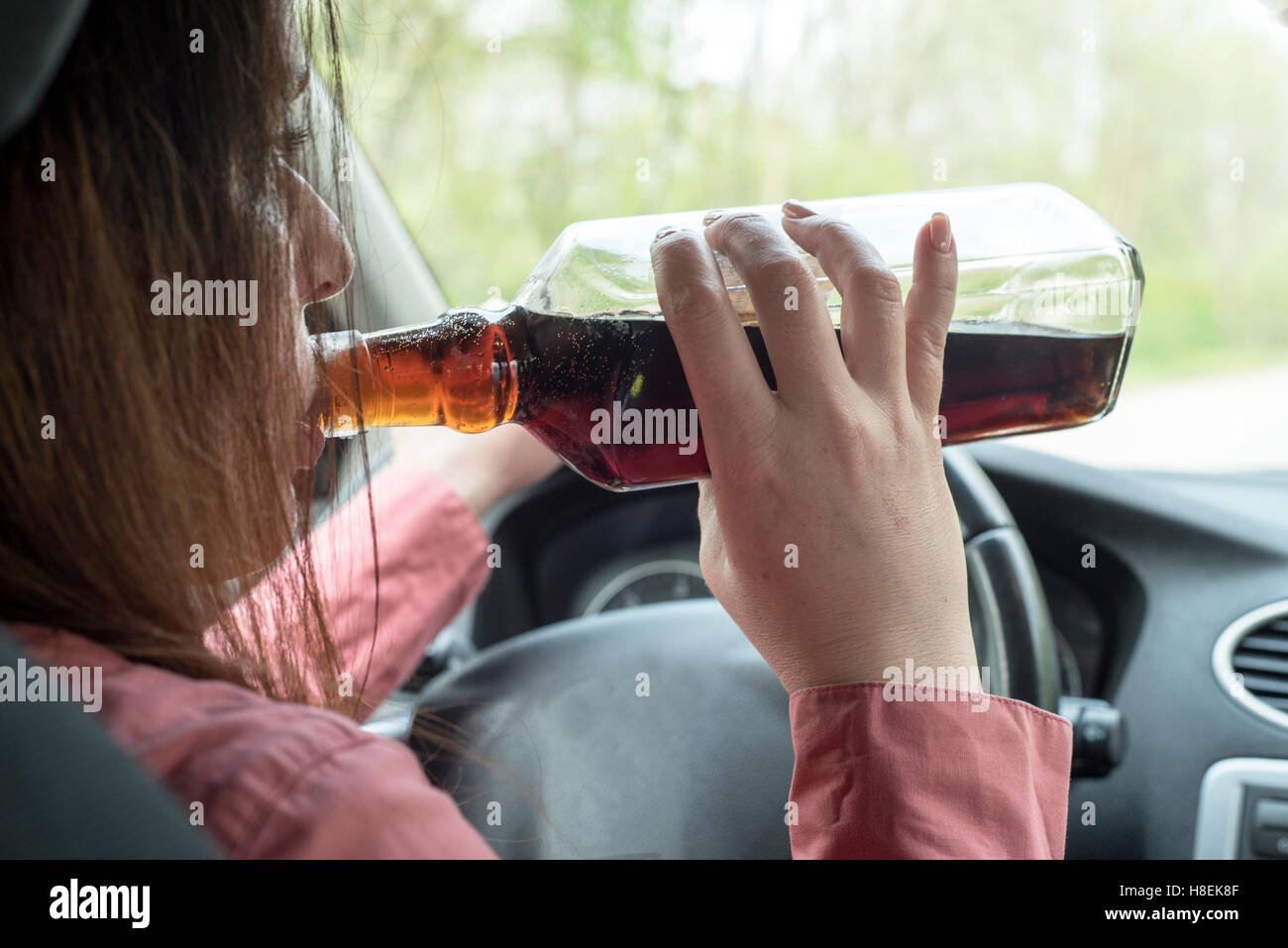 picture of woman drinking alcohol in the car Stock Photo - Alamy