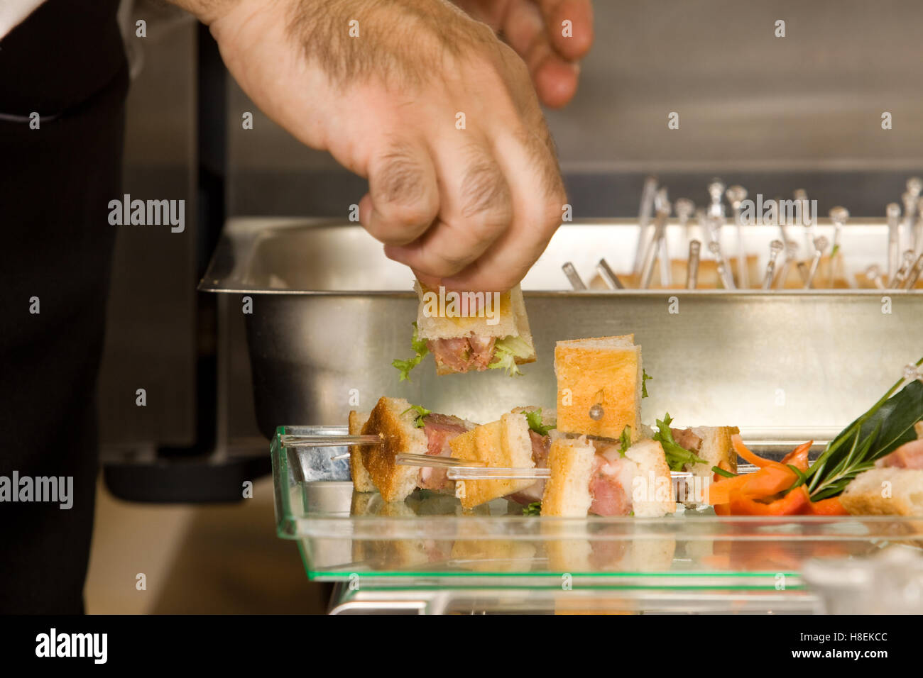 cook preparing the sandwich in a restaurant kitchen Stock Photo - Alamy