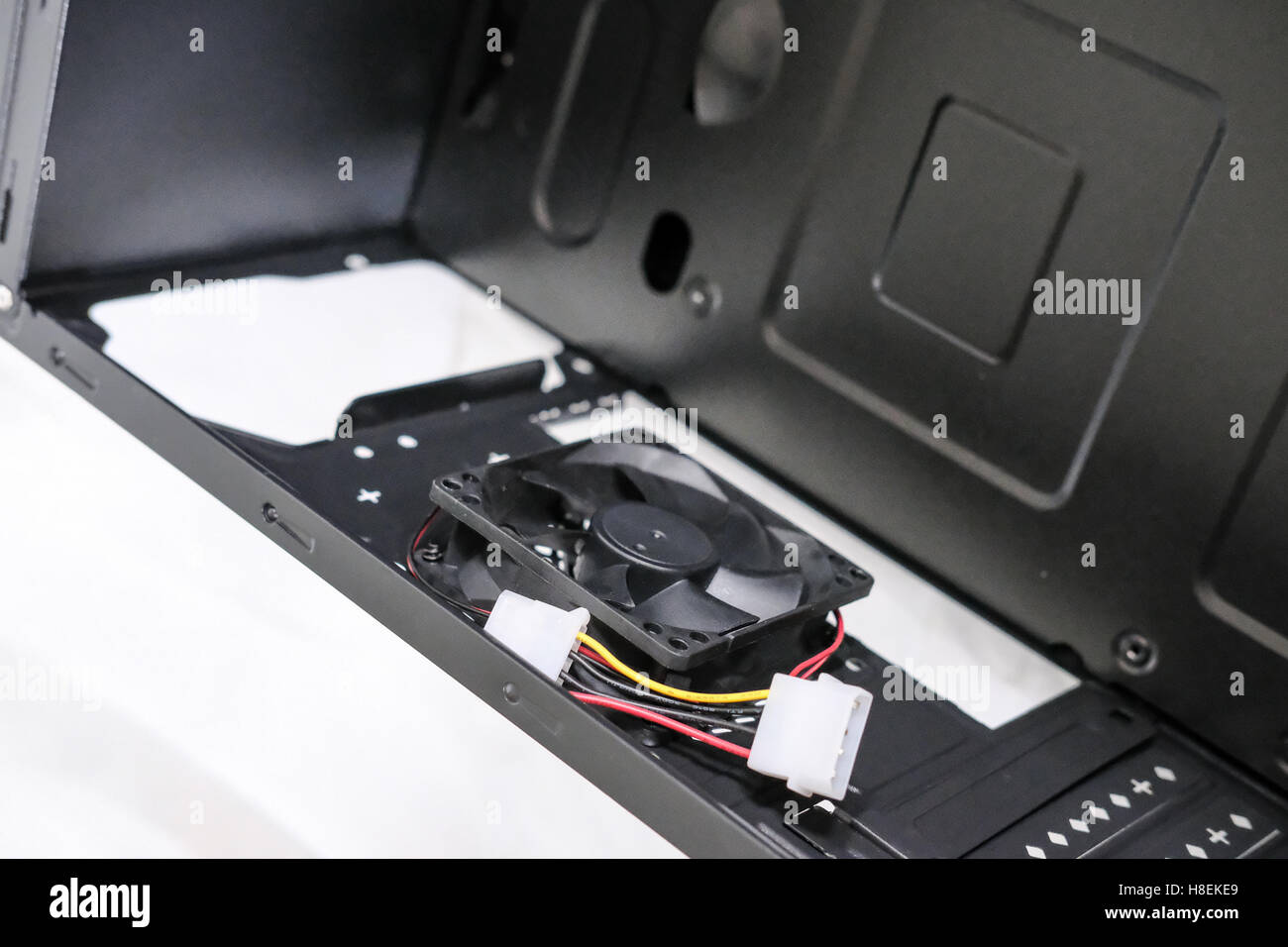 Detail of a PC MiniTAX case showing a newly installed cooling fan and ...
