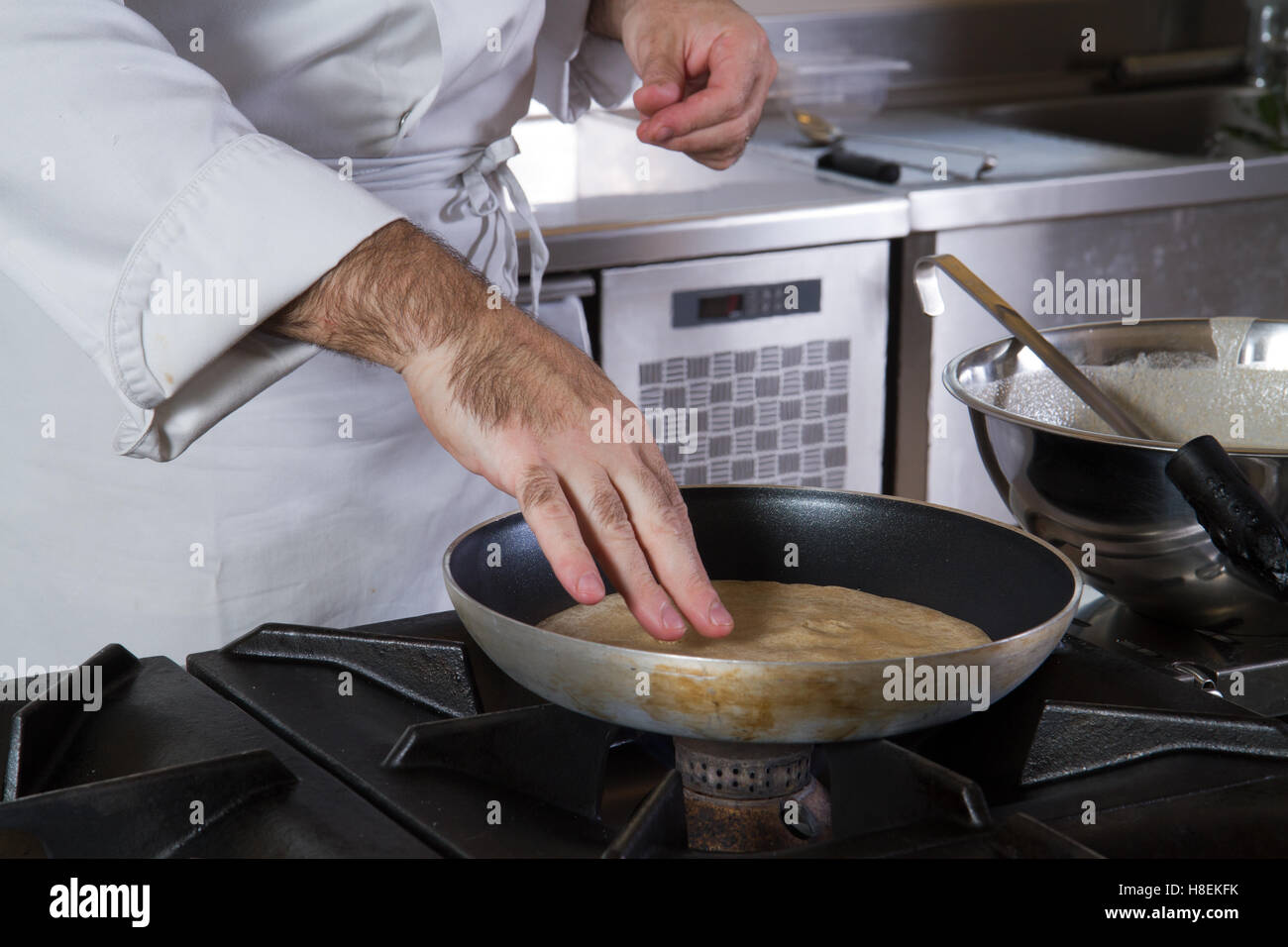 cook at work in a kitchen restaurant Stock Photo - Alamy