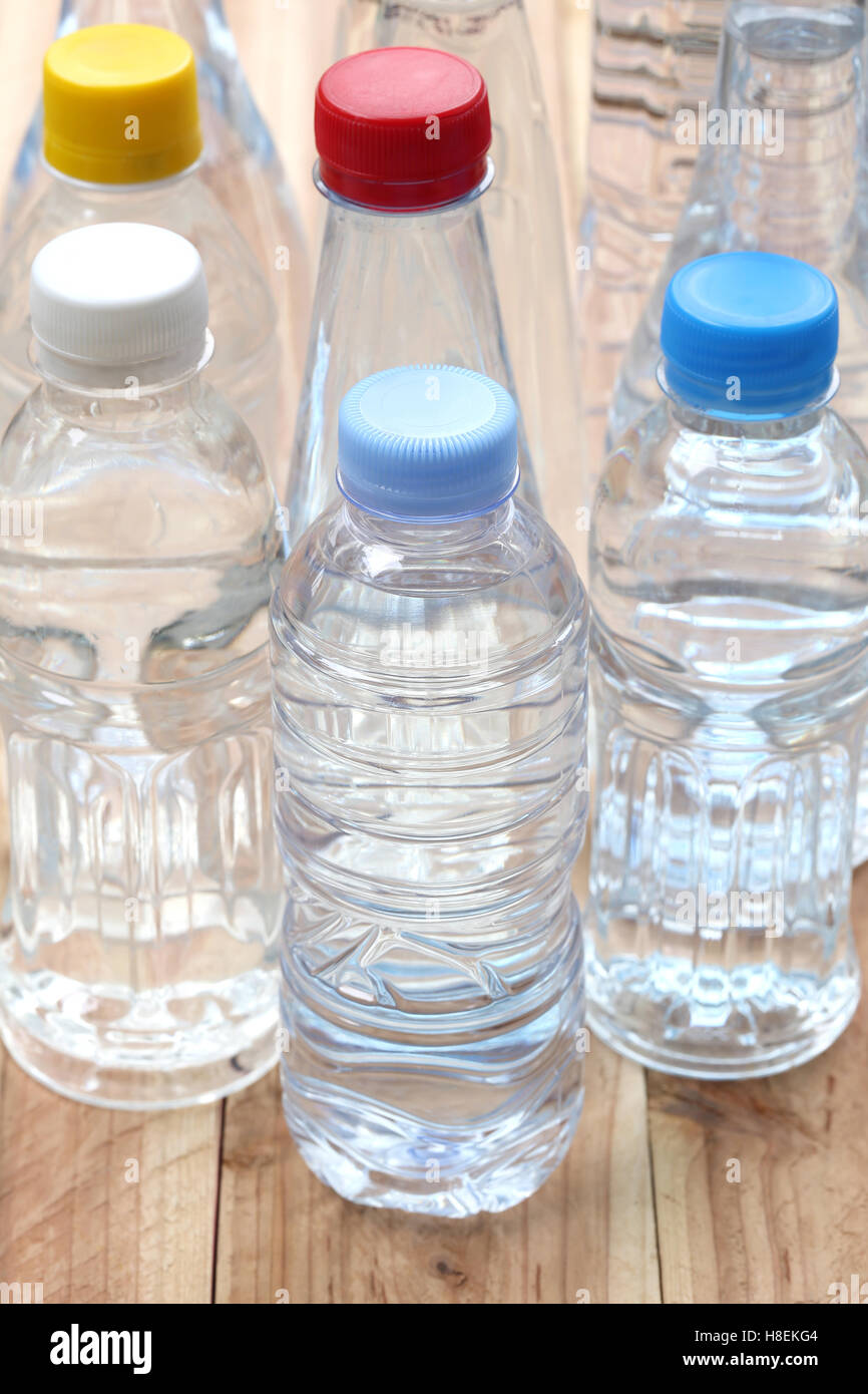 Plastic of Water bottles on wooden floor Stock Photo - Alamy