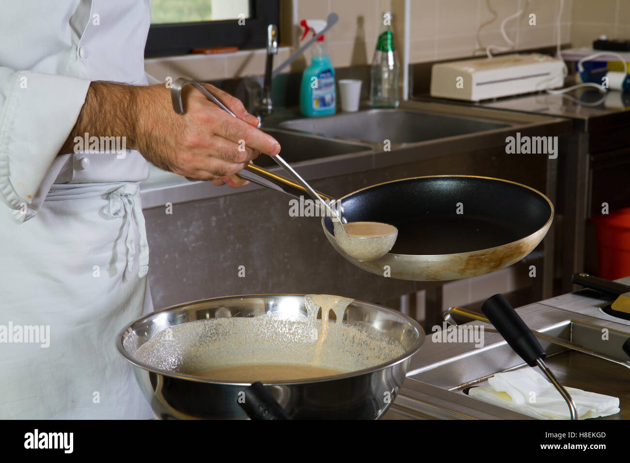 cook at work in a kitchen restaurant Stock Photo - Alamy