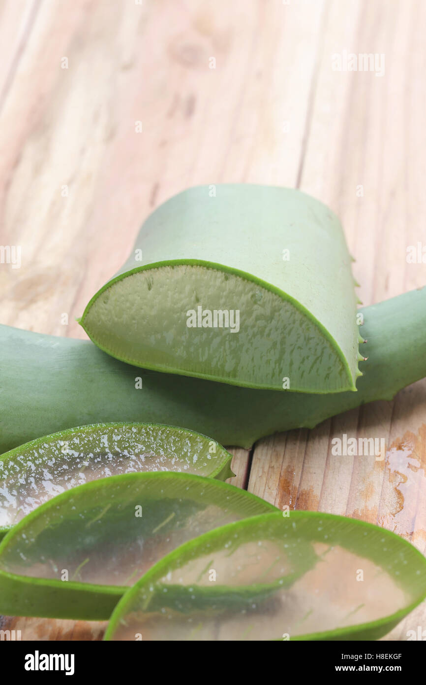 aloe vera slice on wooden floor and can you see texture of aloe vera ...