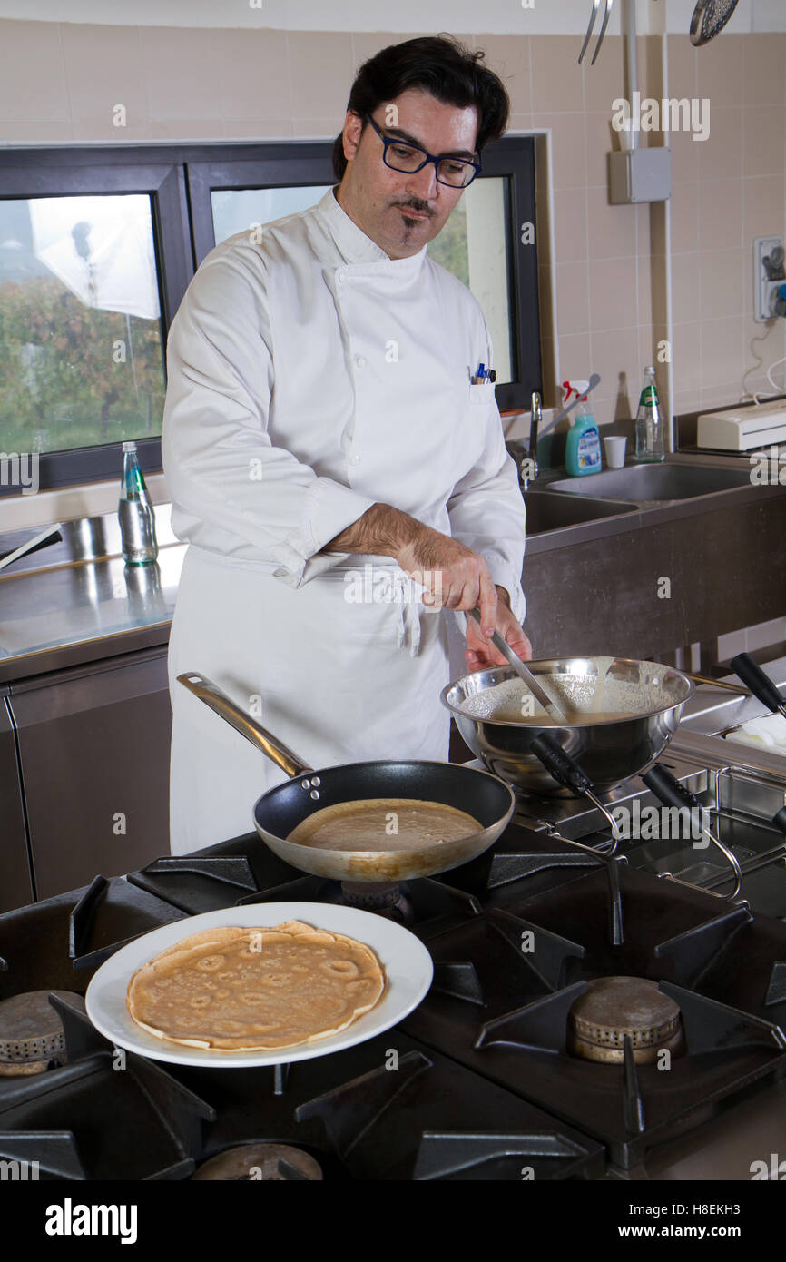 cook working in a kitchen restaurant Stock Photo - Alamy