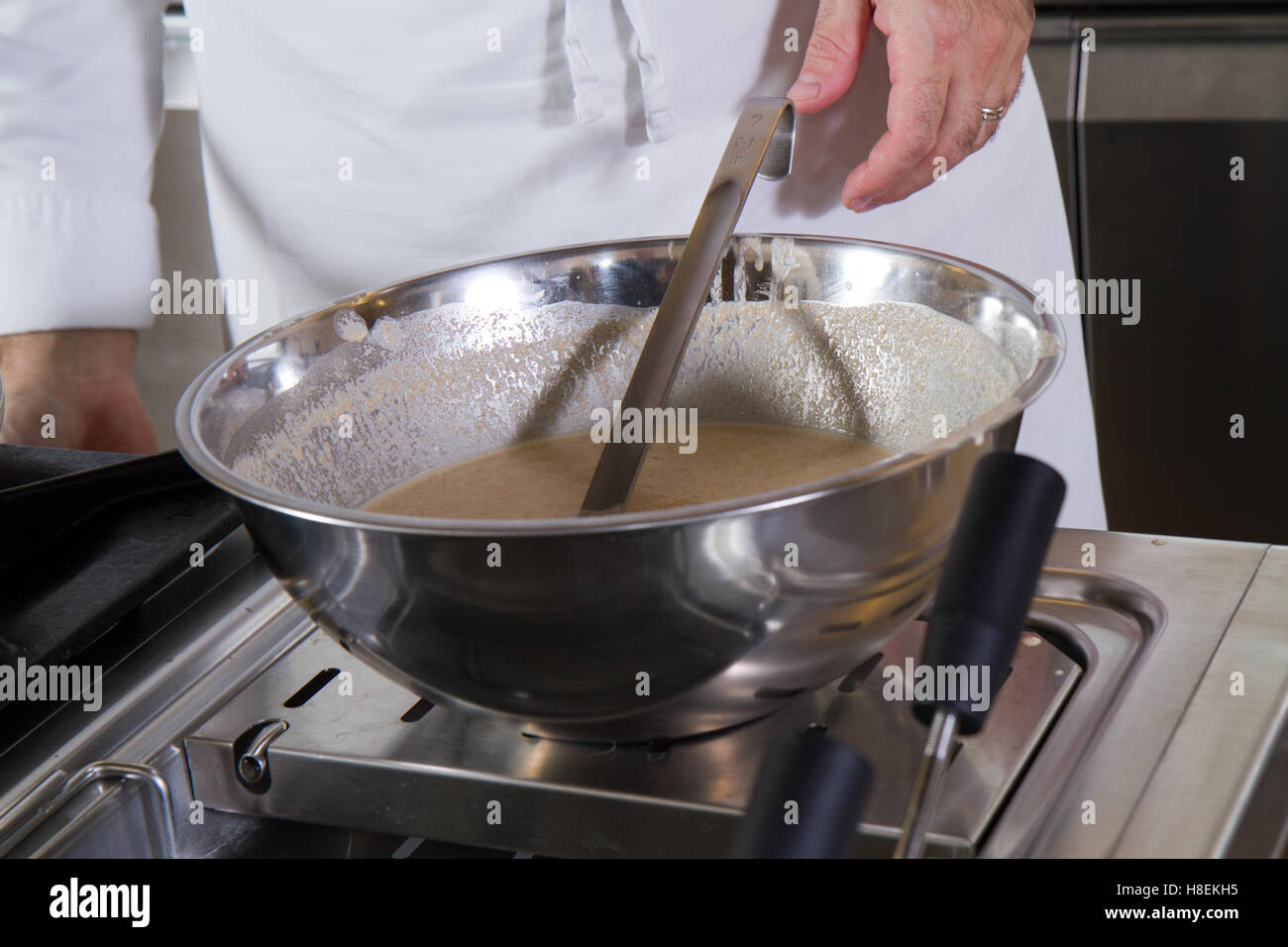 cook at work in a kitchen restaurant Stock Photo - Alamy